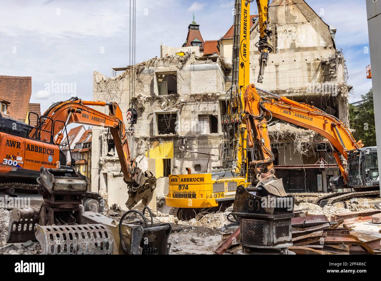 Demolition of a building, demolition excavator during the ...