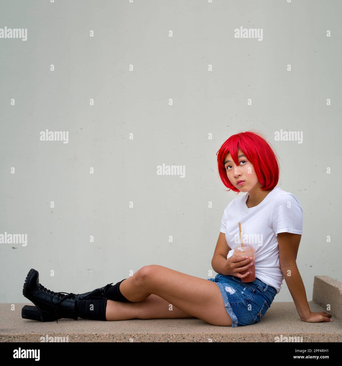 Teenage Girl Wearing Cosplay Outfit Sitting on Concrete Bench and ...