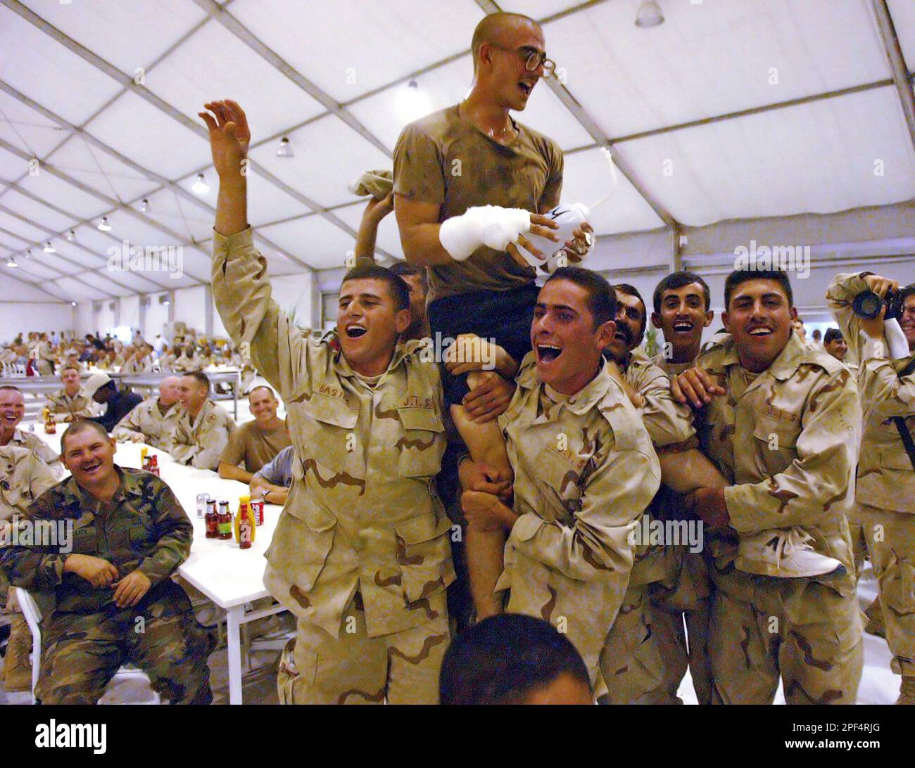 Iraqi soldiers hold U.S. Army 101st Airborne Division's Spc. Kevin Rice ...