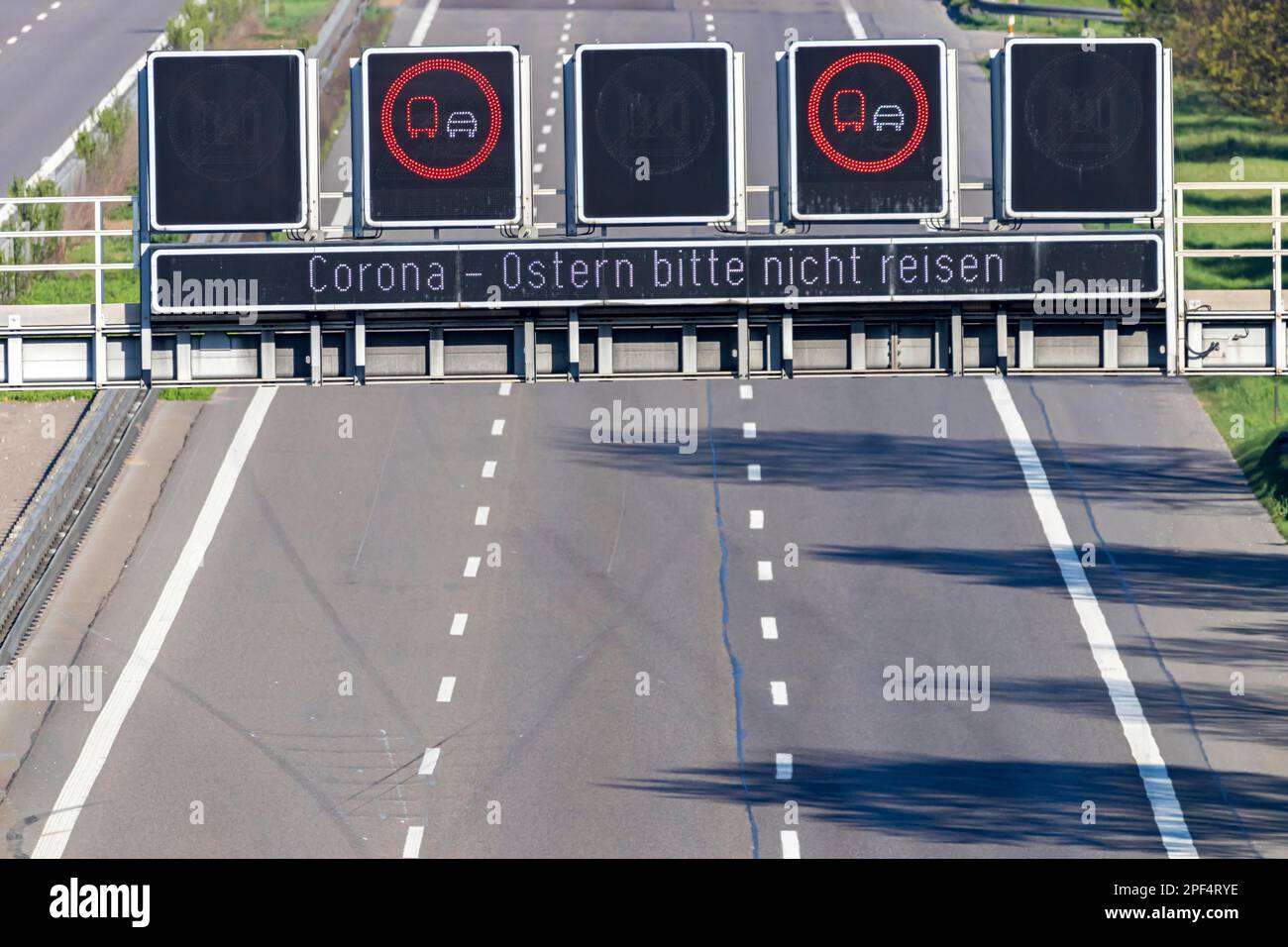 Corona, Easter please do not travel. Traffic sign, changing display on ...