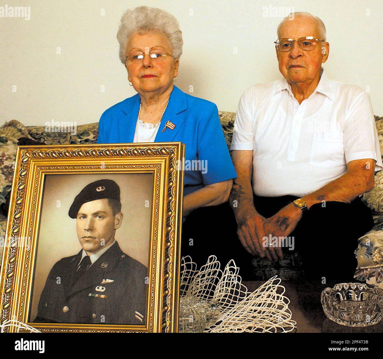 Robert and Dorothy Locker proudly display a photo of their son, U.S ...