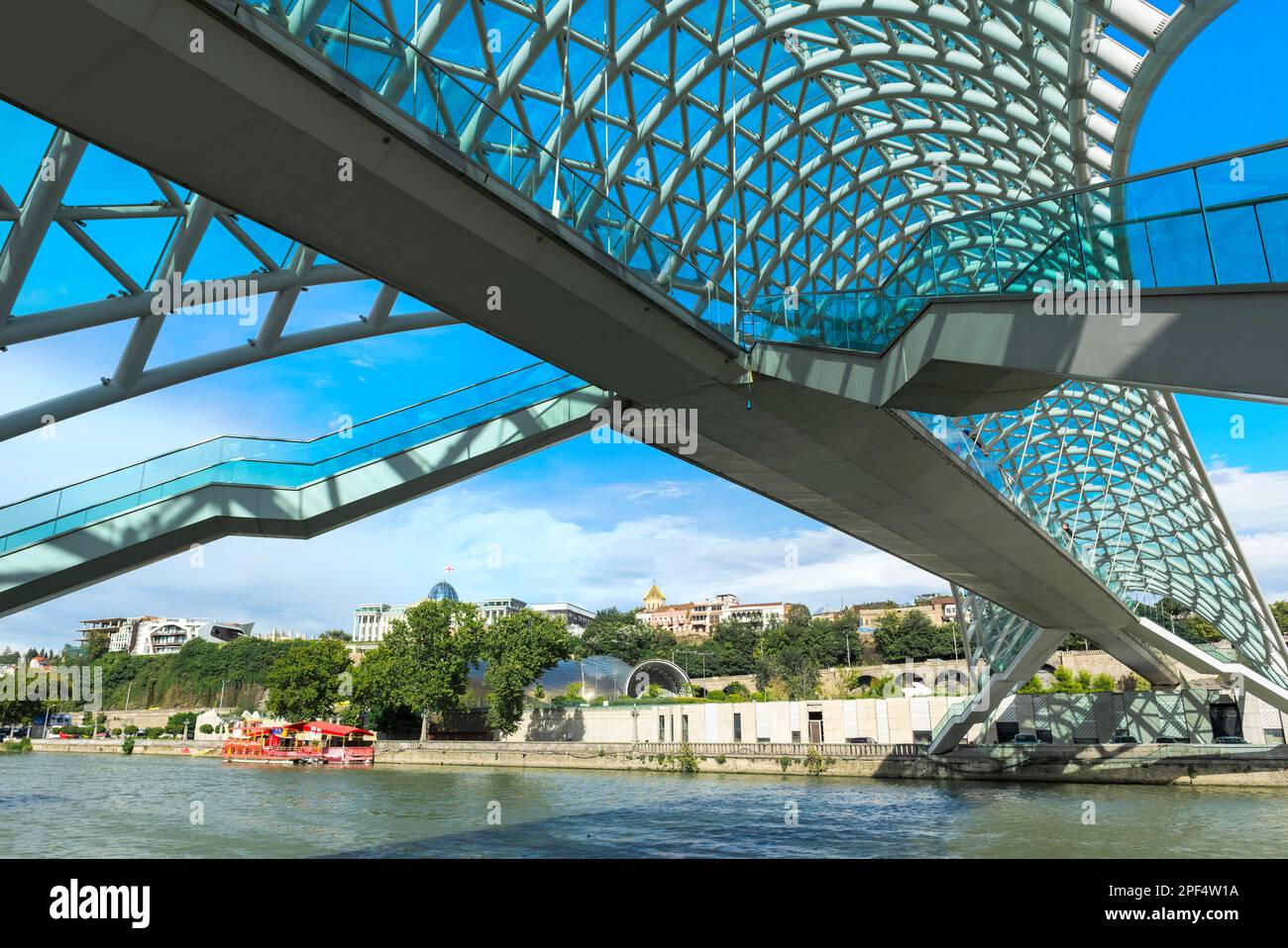 Peace Bridge over the Mtkvari River, designed by Italian architect Michele de Lucci, Tbilisi ...