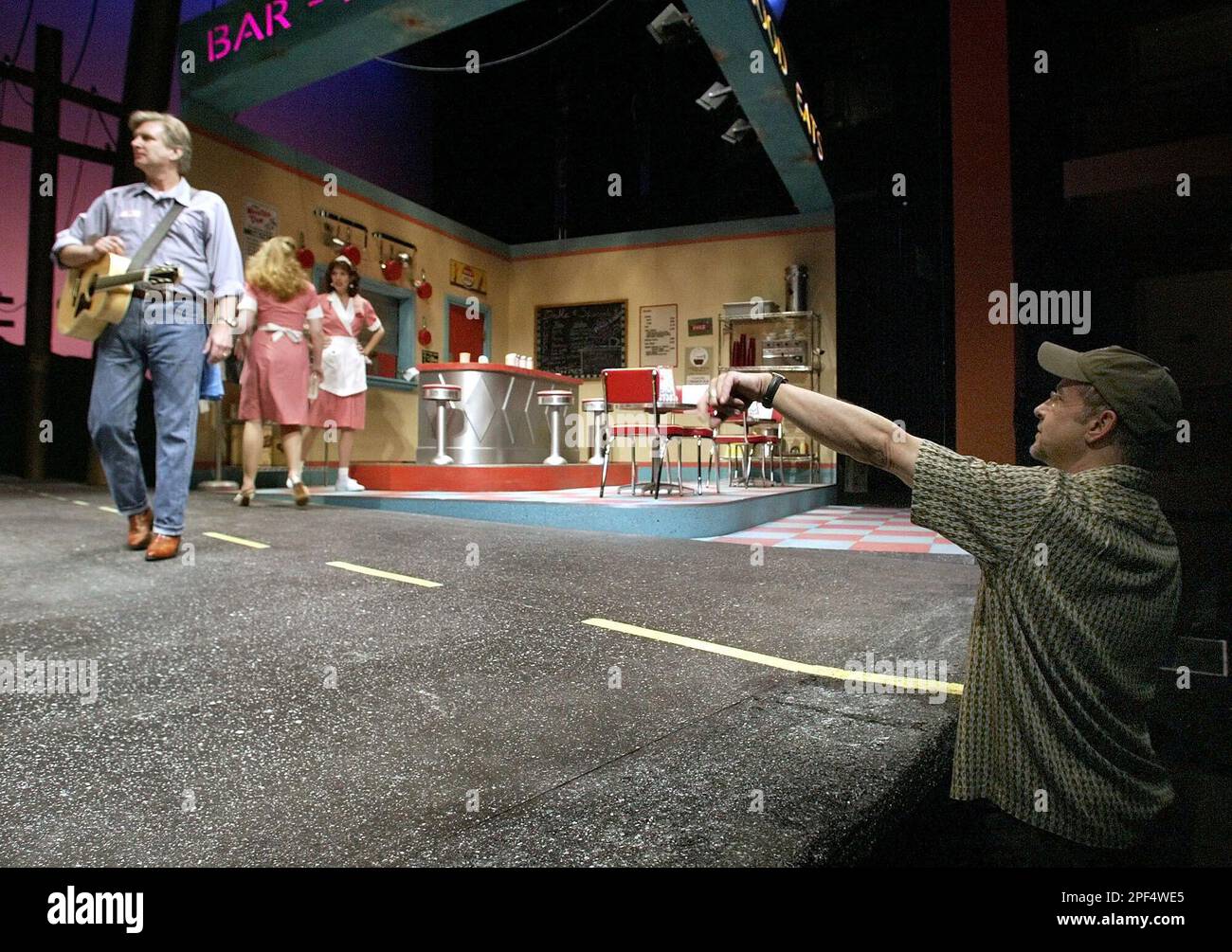 Michael Bush, far right, directs actors Jim Wann, left, Lynne ...