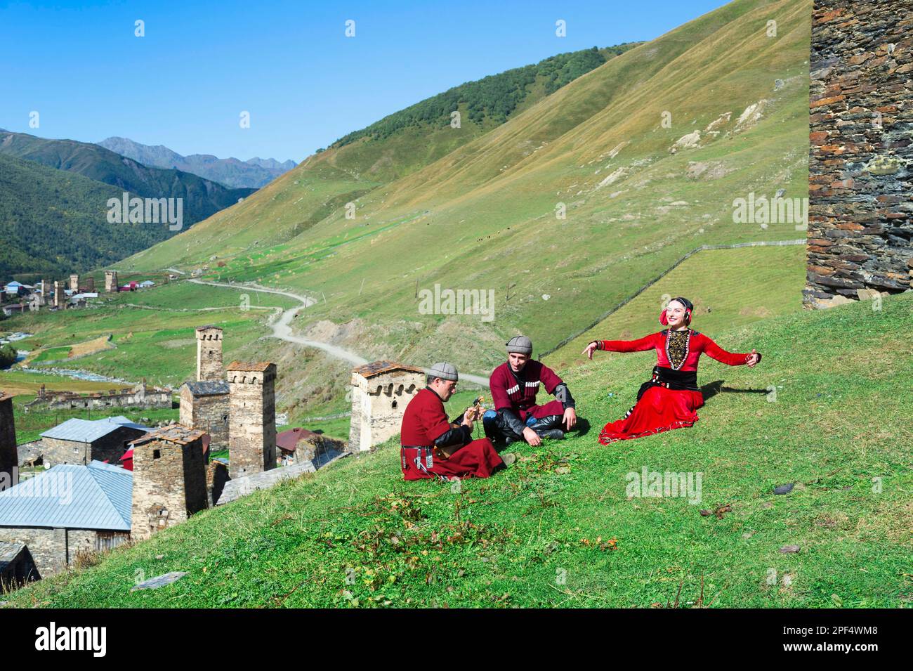 Georgian people from a folkloric group playing panduri and dancing in ...
