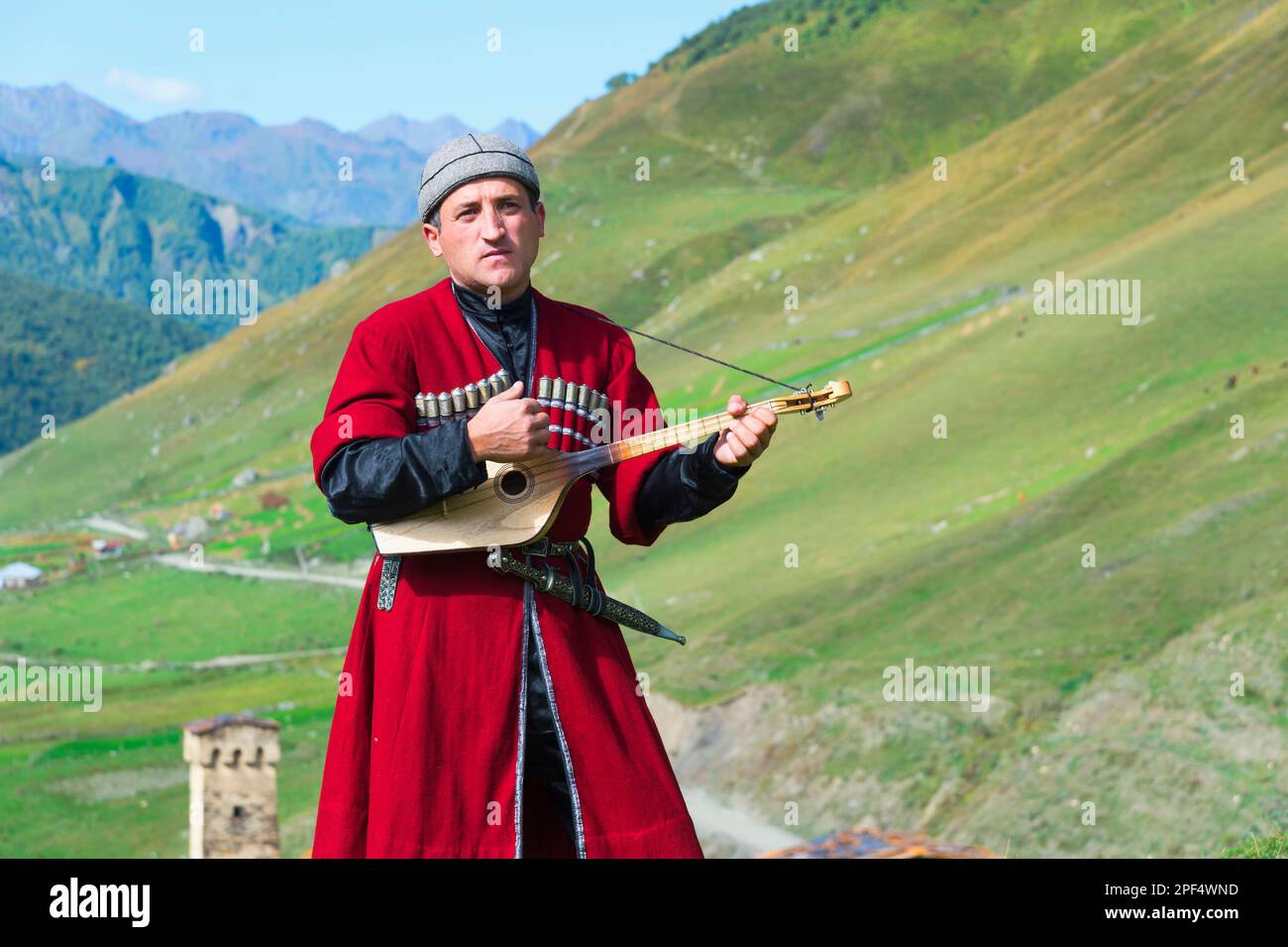 Georgian musician of a folklore group playing panduri, For editorial ...