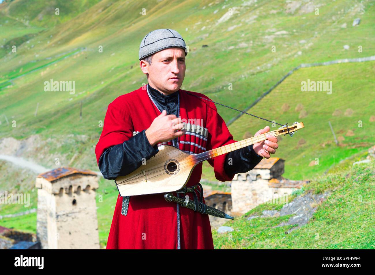 Georgian musician of a folklore group playing panduri, For editorial ...