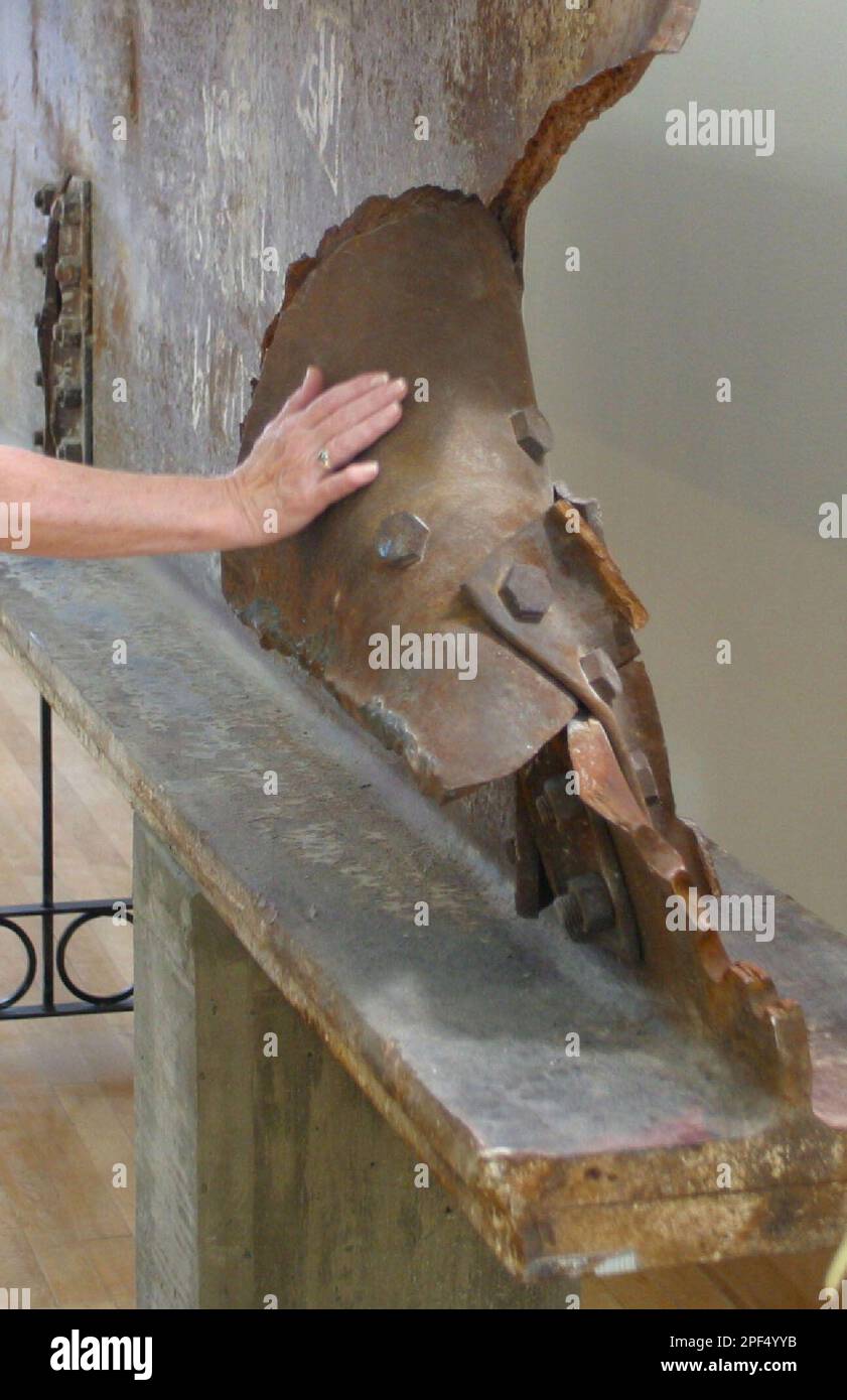 Kit Elliott, who was a disaster nurse at "Ground Zero," touches a bent ...