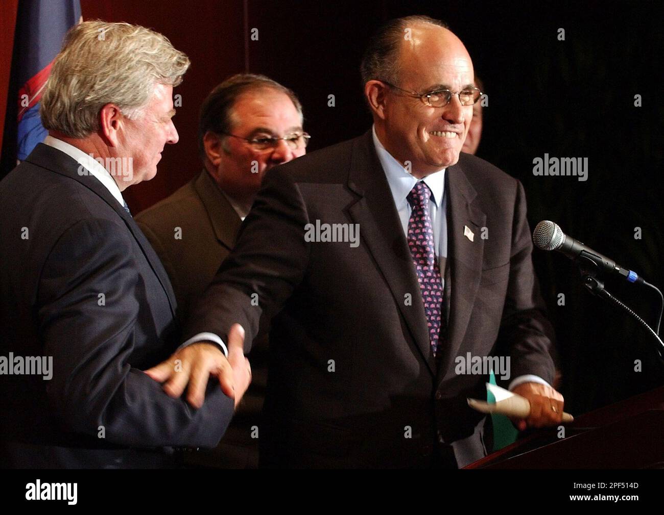 Former New York City Mayor Rudolph Giuliani, right, gestures during a ...