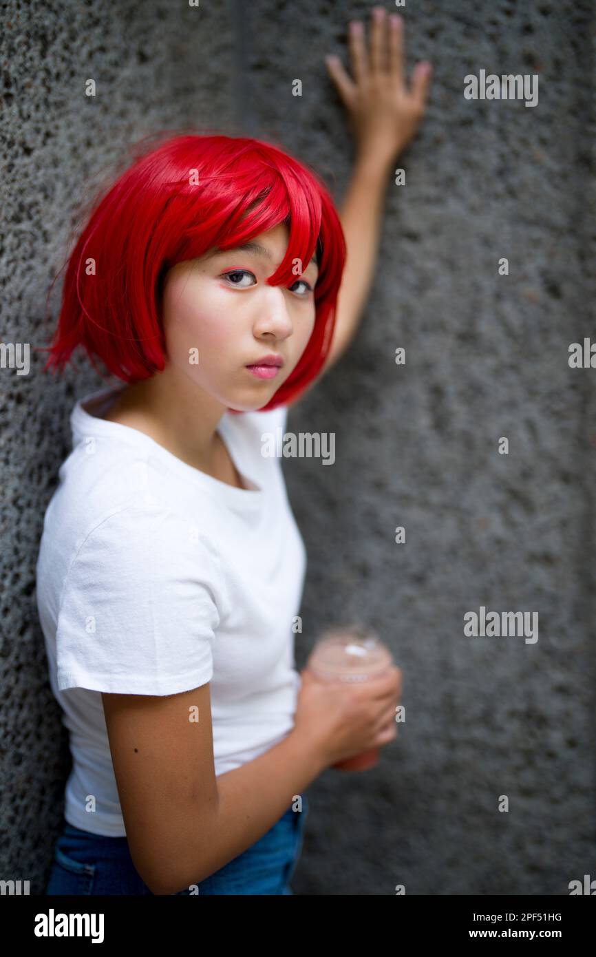 Teenage Girl in Cosplay Costume Standing with Smoothie and Leaning on ...
