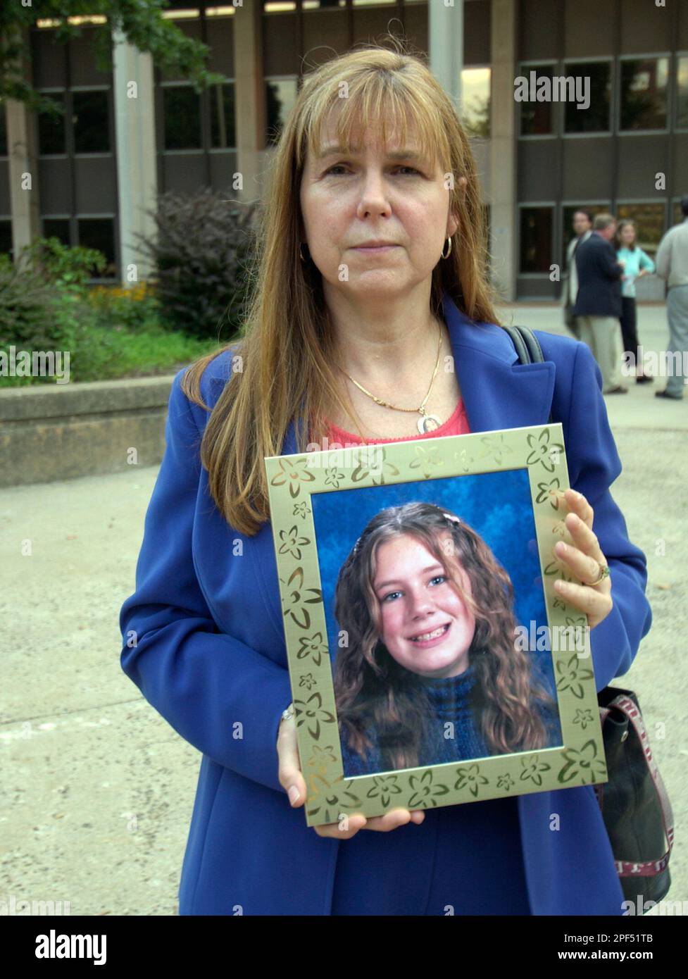 Shelley Riling holds a photograph of her niece Christina Long outside ...