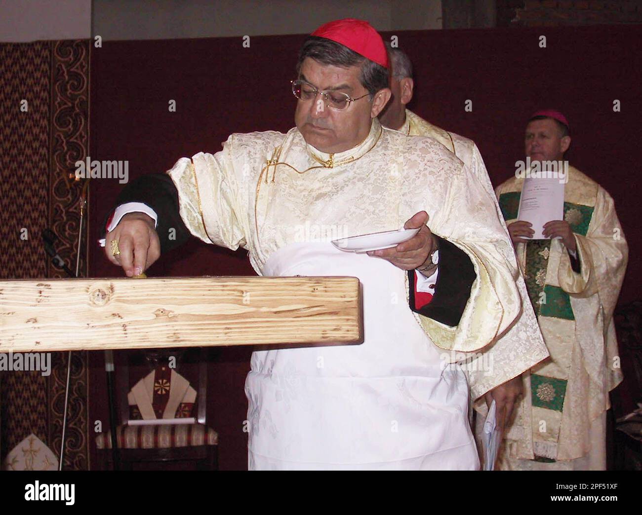 Cardinal Crescenzio Sepe anoints a wooden table to be a holy altar in ...