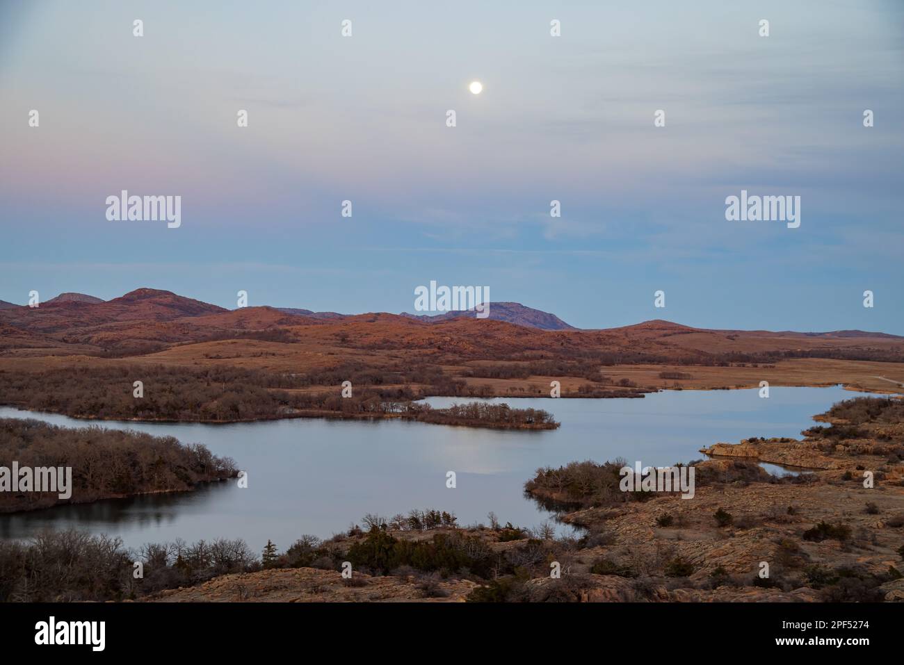 Sunset landscape with a full moon in Wichita Mountains National ...