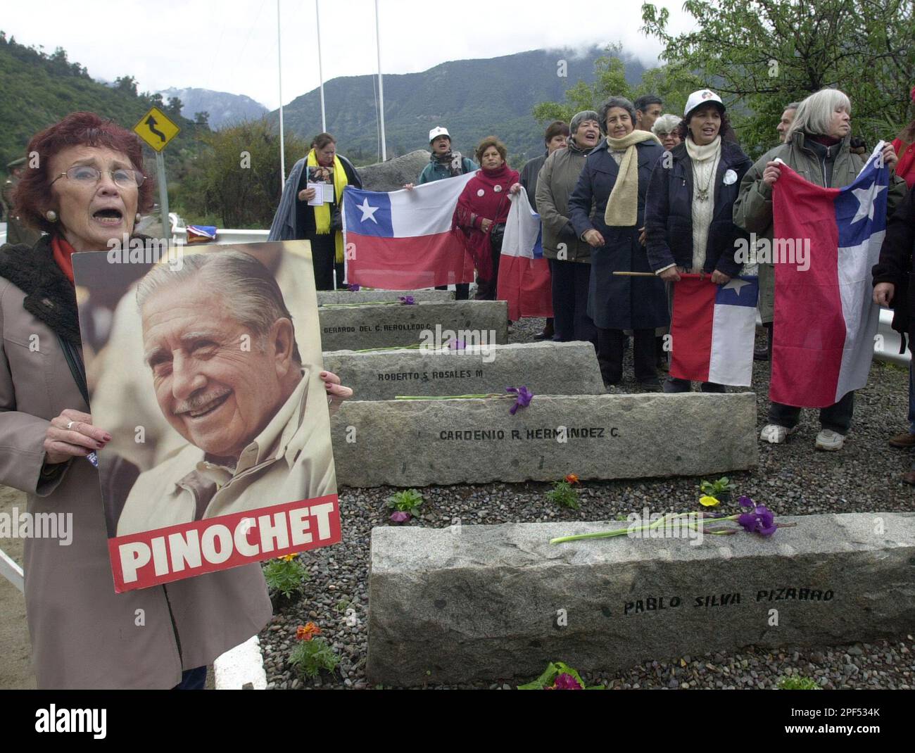 Supporters of former dictator Gen. Augusto Pinochet sing their national ...