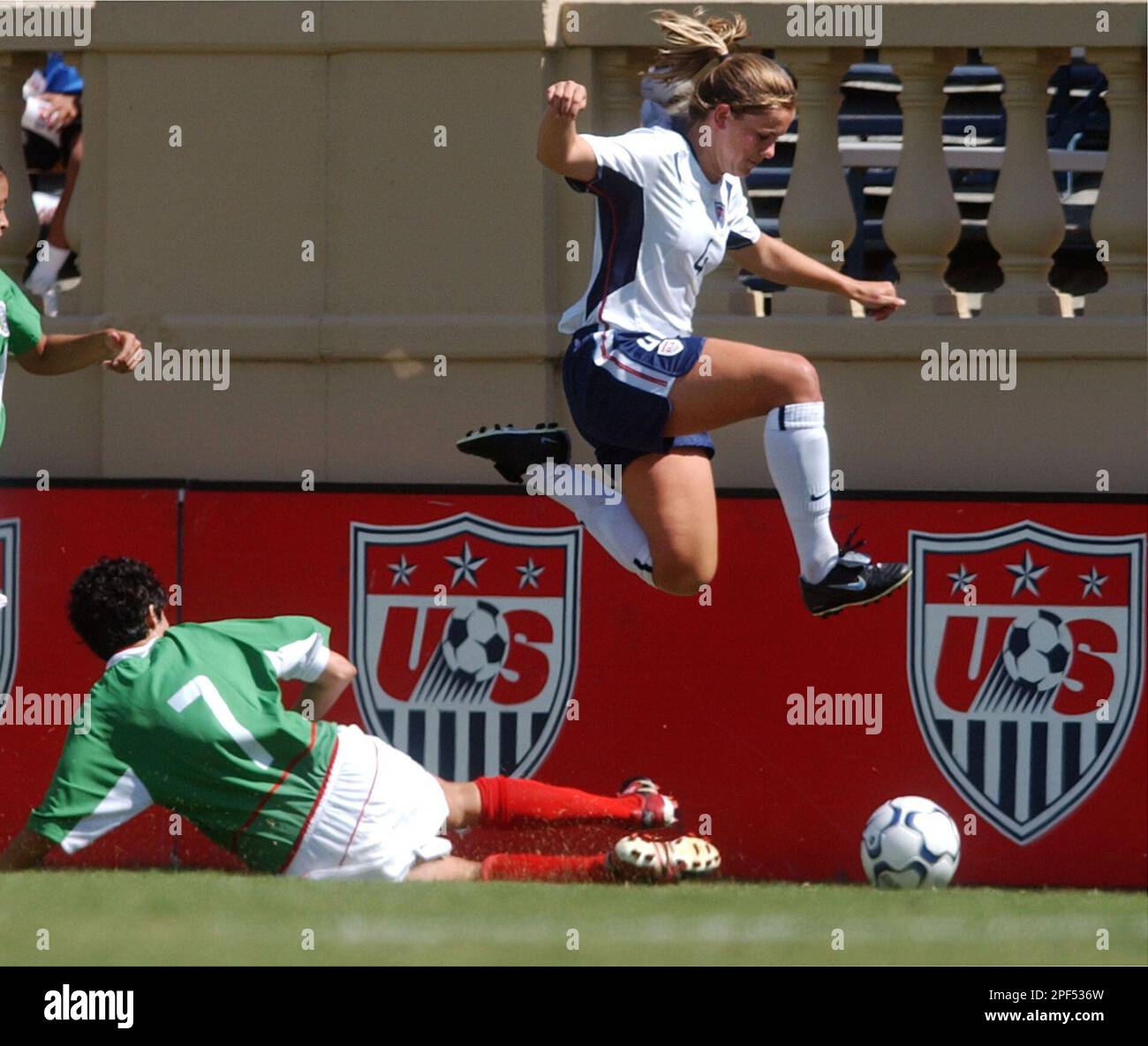 United States defender Cat Reddick, right, leaps over Mexico defender ...