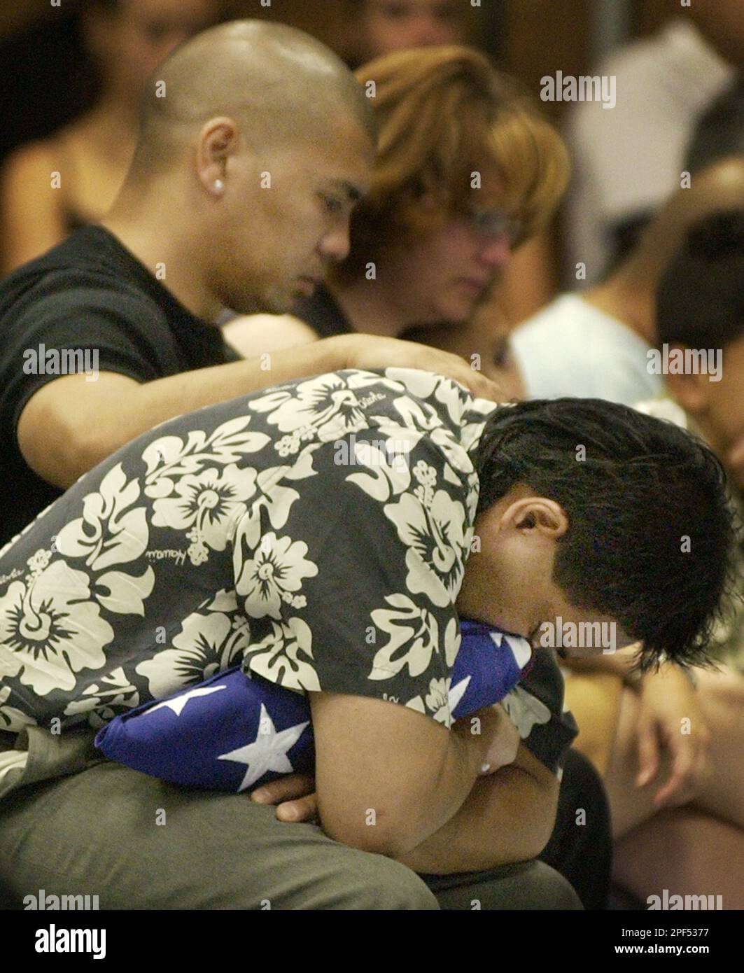 James Sarno Jr. front, cries into the flag from his brother's coffin ...
