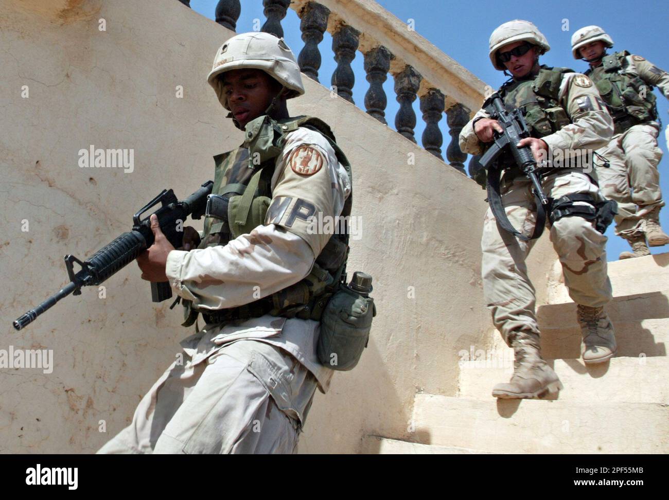 U.S. Army Spc. Troy Rander, left, and other members of the 720th ...