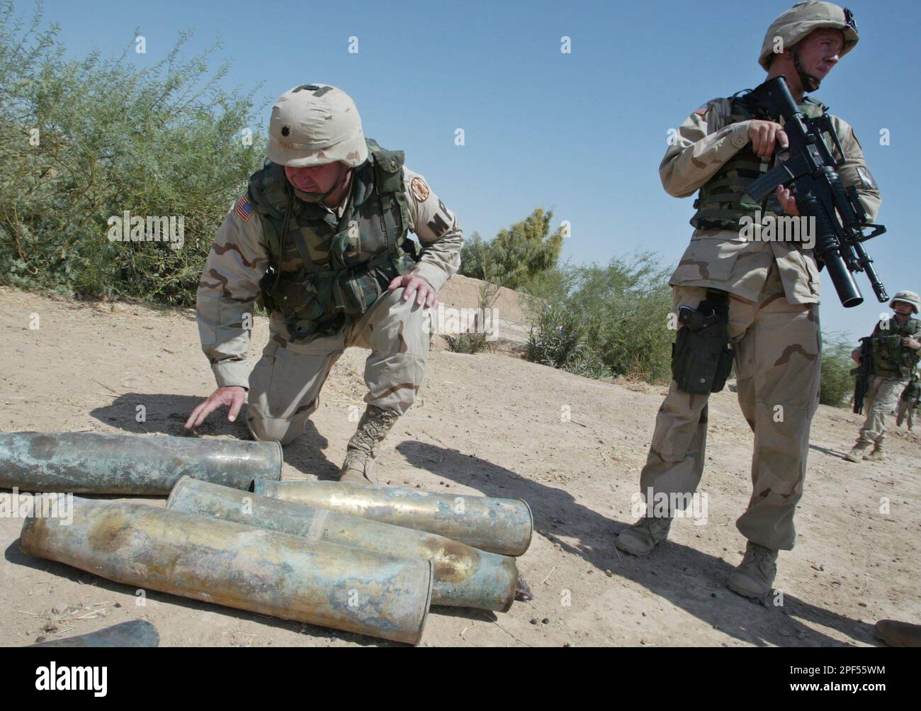 Lt. Col. David Poirier, commander of the 720th MP Battalion, left ...