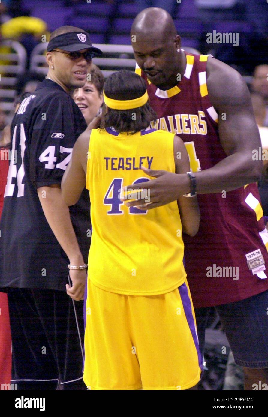 Los Angeles Sparks' Nikki Teasley, center, gets a hug from Los Angeles ...