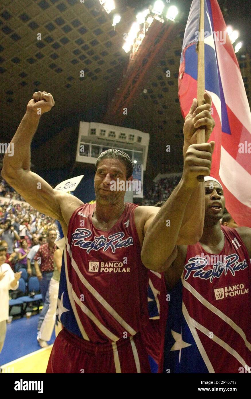 Puerto Rico's Jose Ortiz, left, and Antonio Latimer wave their national ...