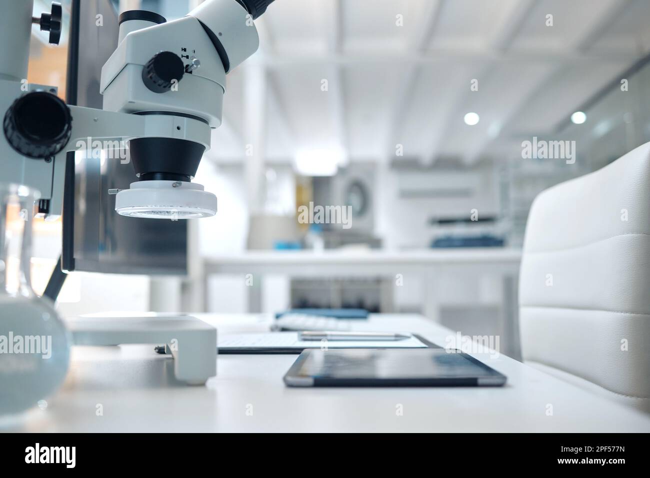 Ready for some work. an empty lab with just a microscope on the desk ...