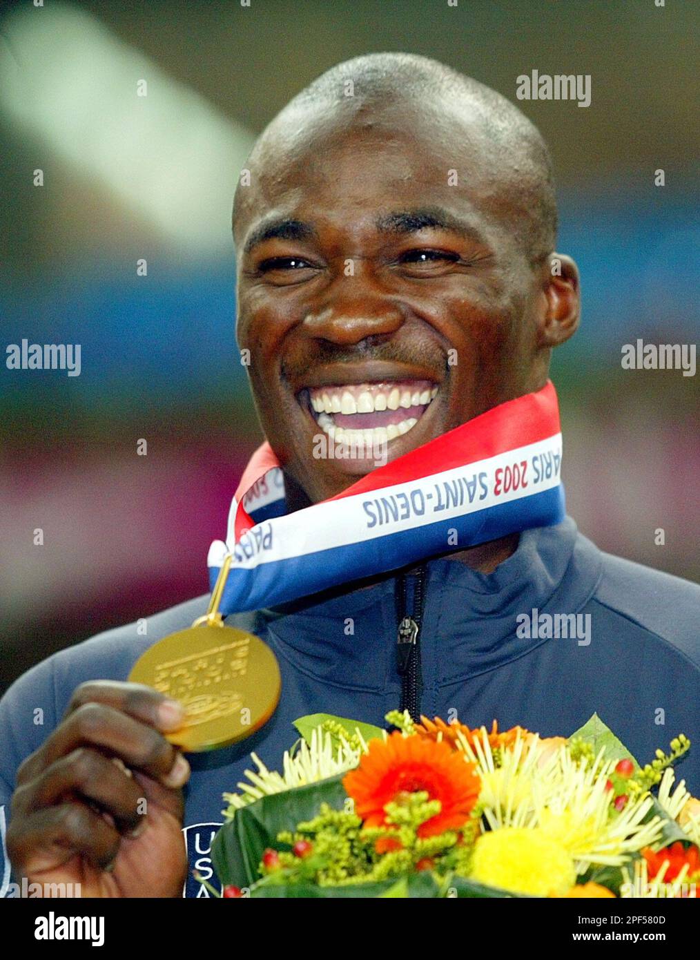 John Capel of the USA displays the gold medal he won in the Men's 200 ...