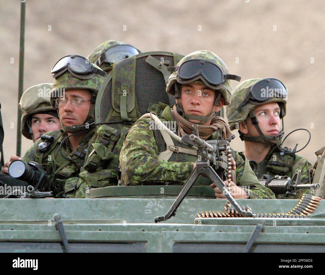 Members of the Canadian 3RCR Battlegroup arrive at a suspected Taliban ...