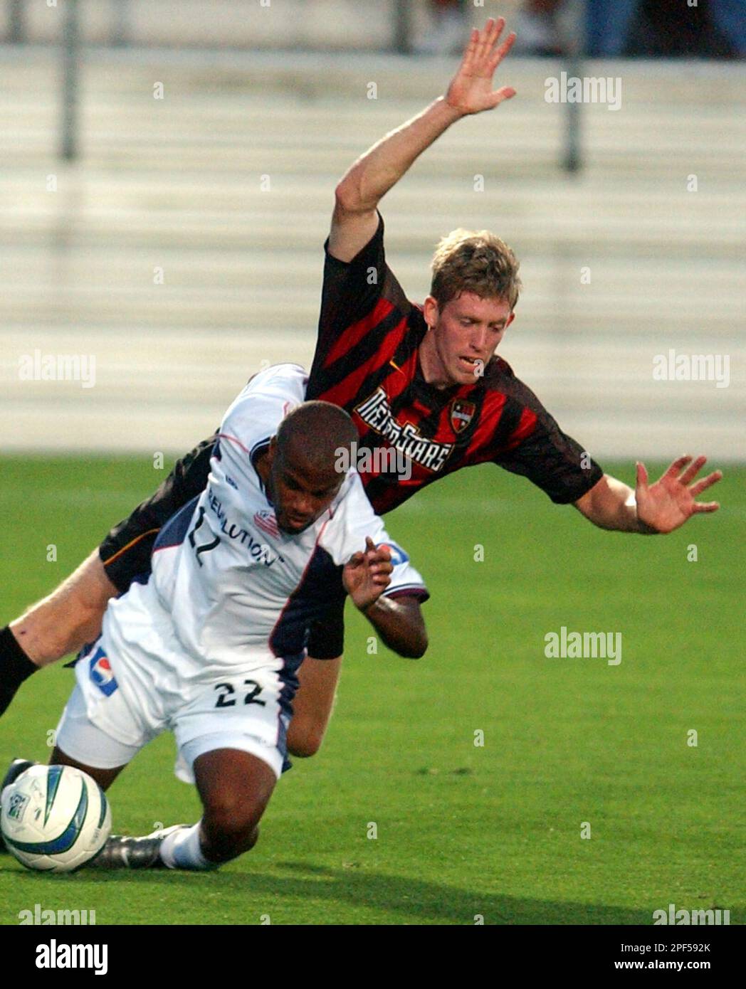 New York/New Jersey MetroStars John Wolyniec, background, battles for ...