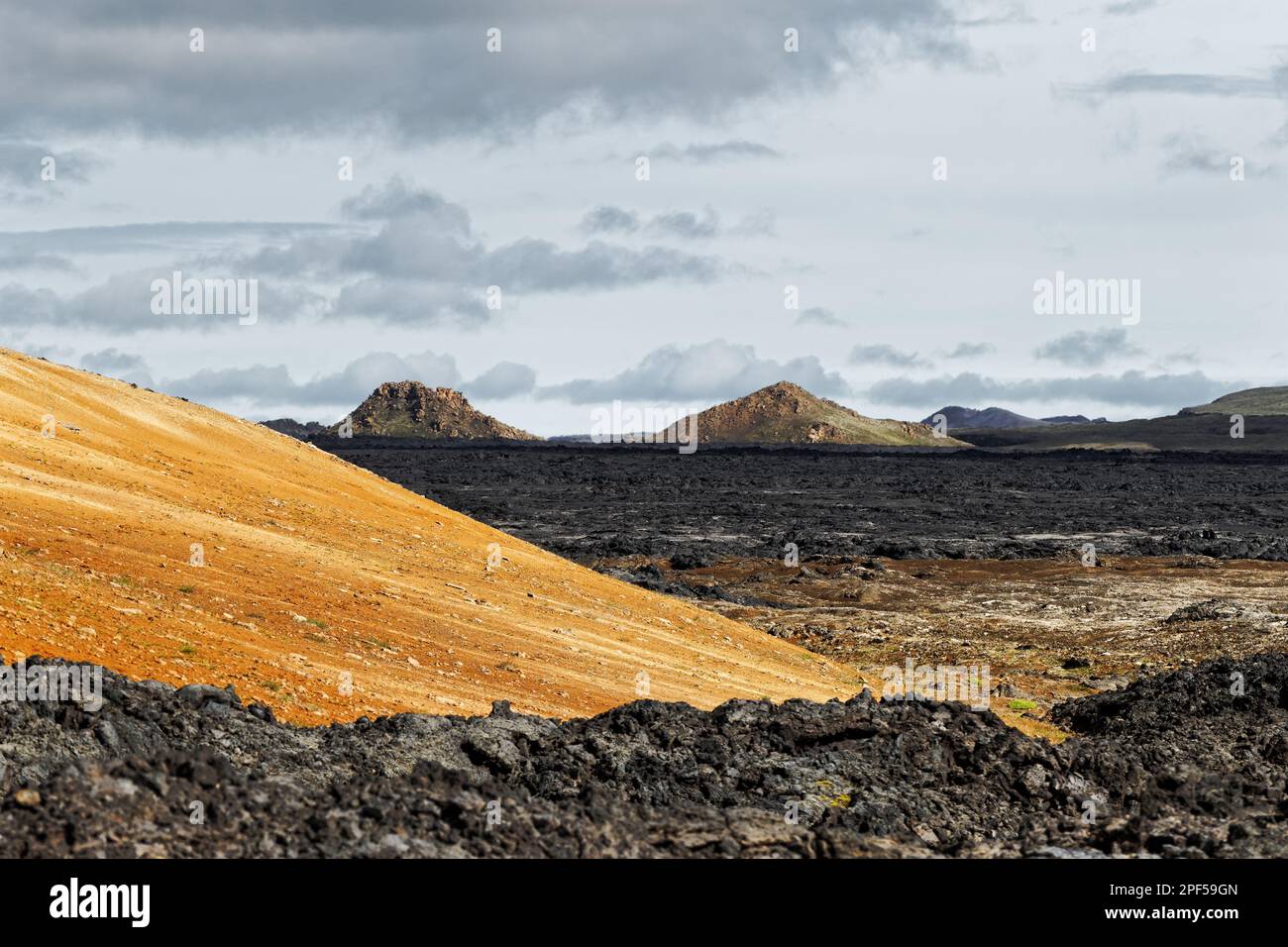 Wide view over a large cooled lava flow in Iceland, a huge volcanic ...
