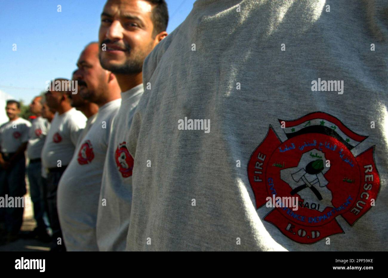 Iraqi firefighters stand in a line during the inauguration of Baghdad's ...