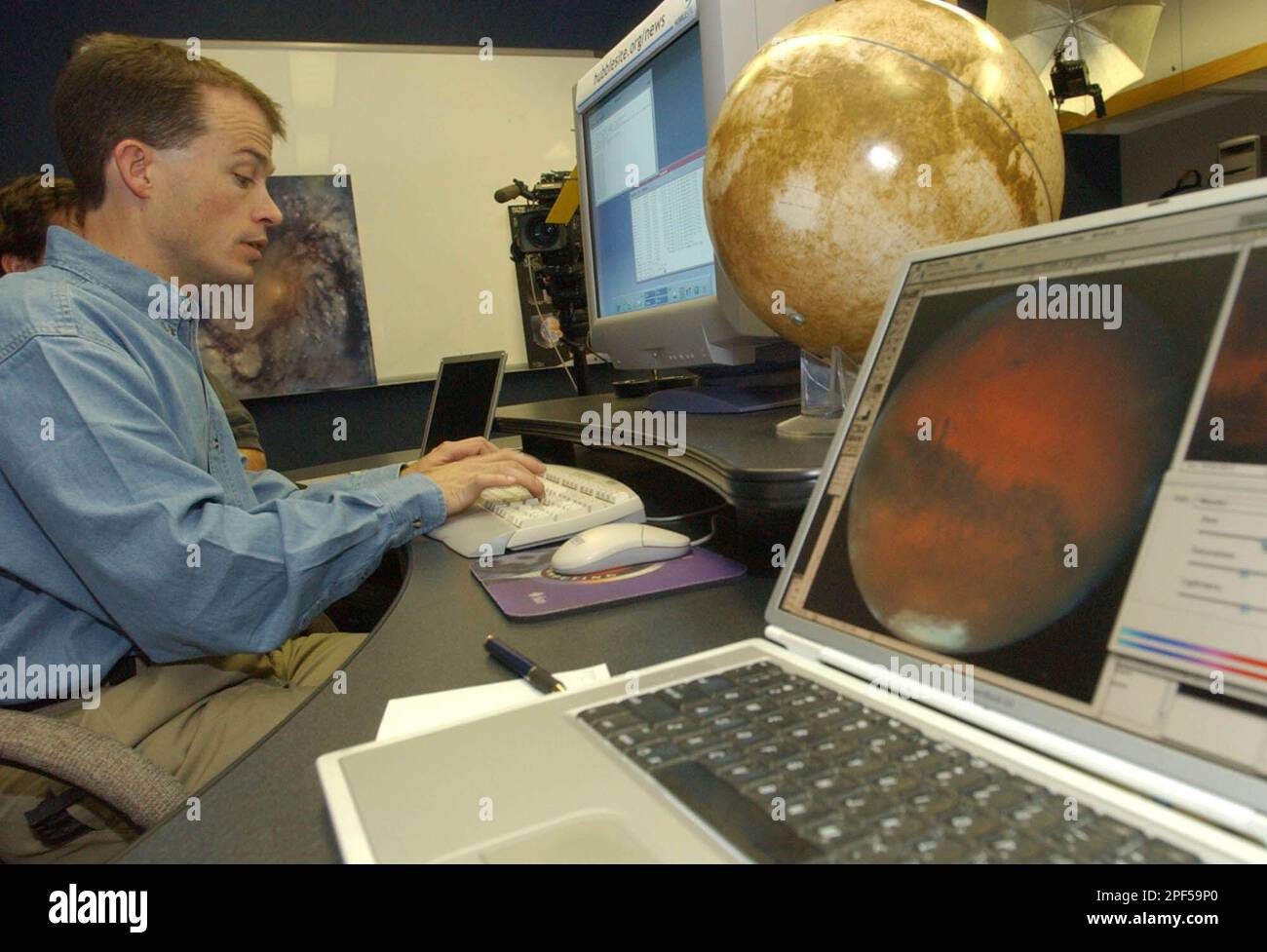 Astronomer Mike Wolff, from the Space Science Institute, retrieves data ...
