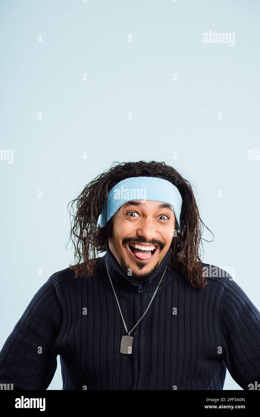 You said be goofy. a handsome young man standing alone in the studio ...