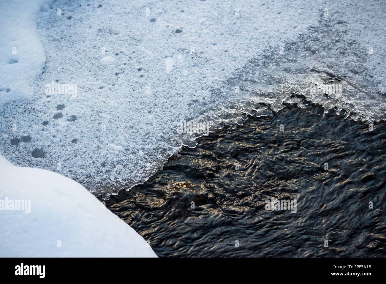 Thin ice covering the water surface of a reservoir Stock Photo - Alamy