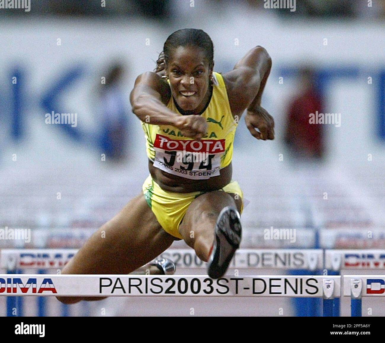 Brigitte Foster of Jamaica competes in a Women's 100 meters hurdles ...