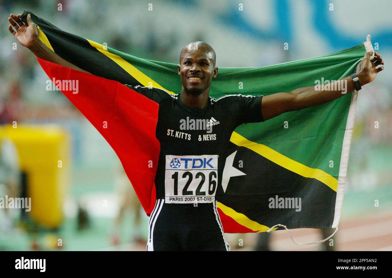 Kim Collins of Saint Kitts and Nevis celebrates after winning the gold ...