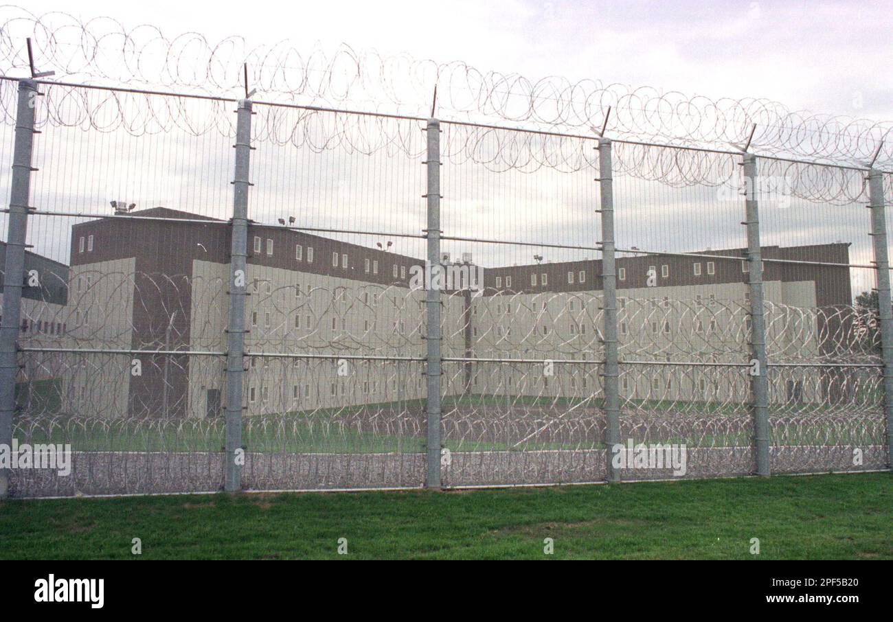 This is a 1998 photo showing the barbed wire high fence surrounding the ...