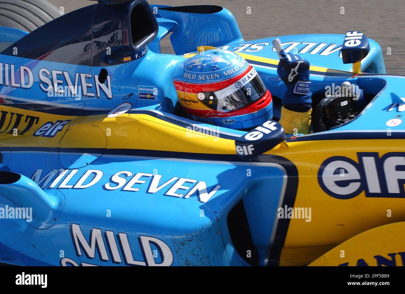 Spanish F1 driver Fernando Alonso of Renault waves from the cockpit as ...