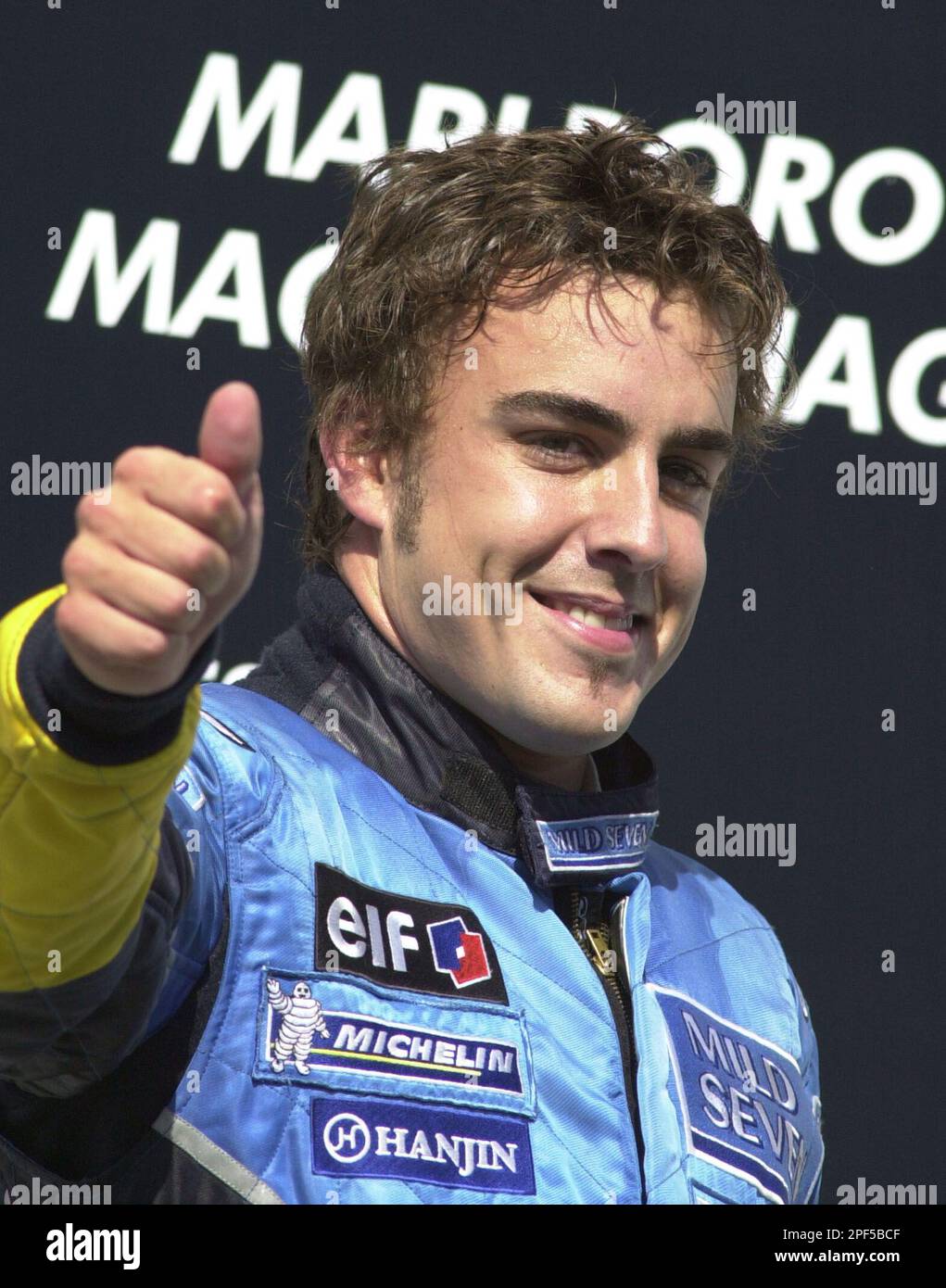 Spainard Fernando Alonso of Renault celebrates on the podium after ...