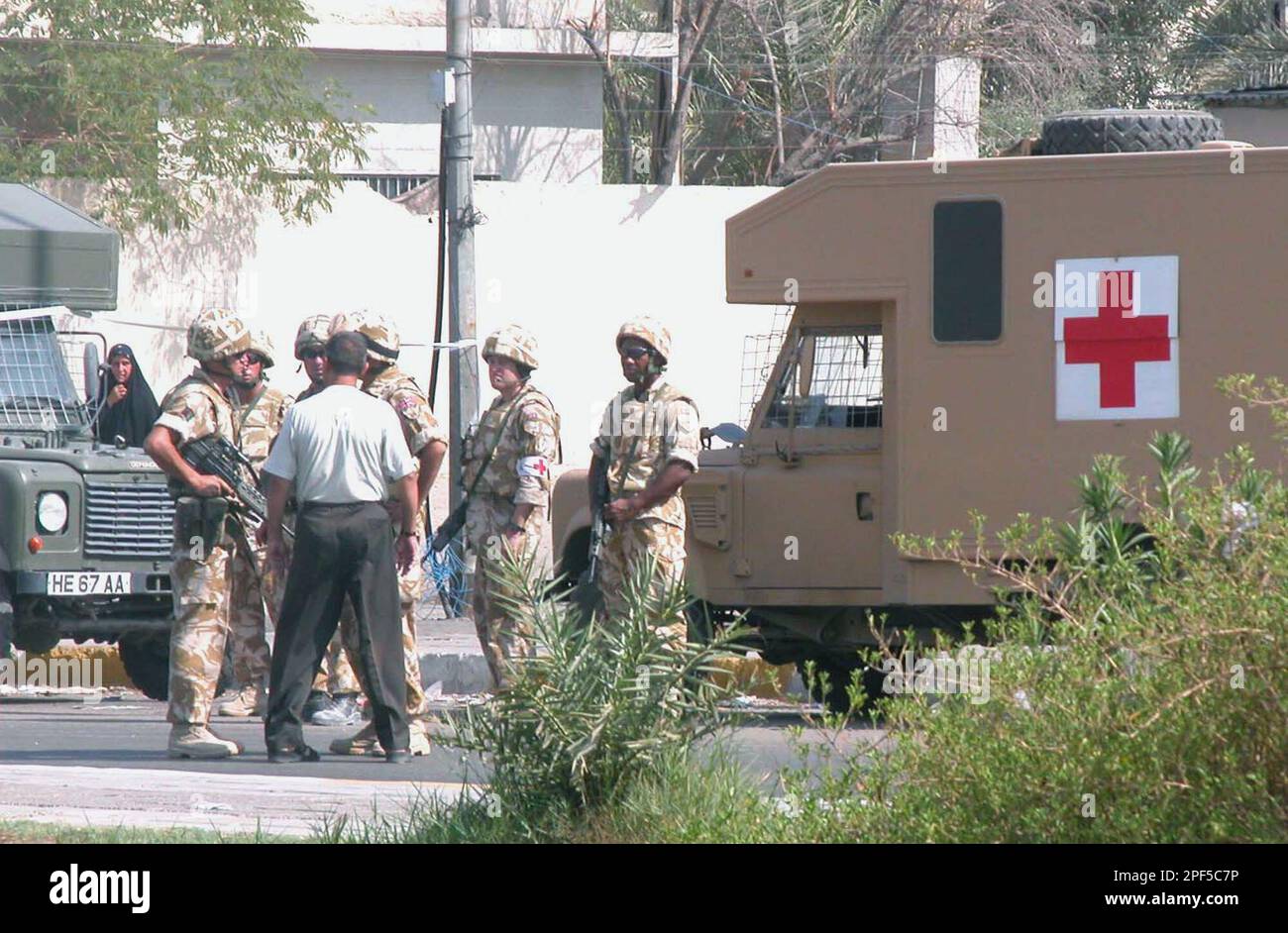 British soldiers meet in front of military ambulances at the site of an ...