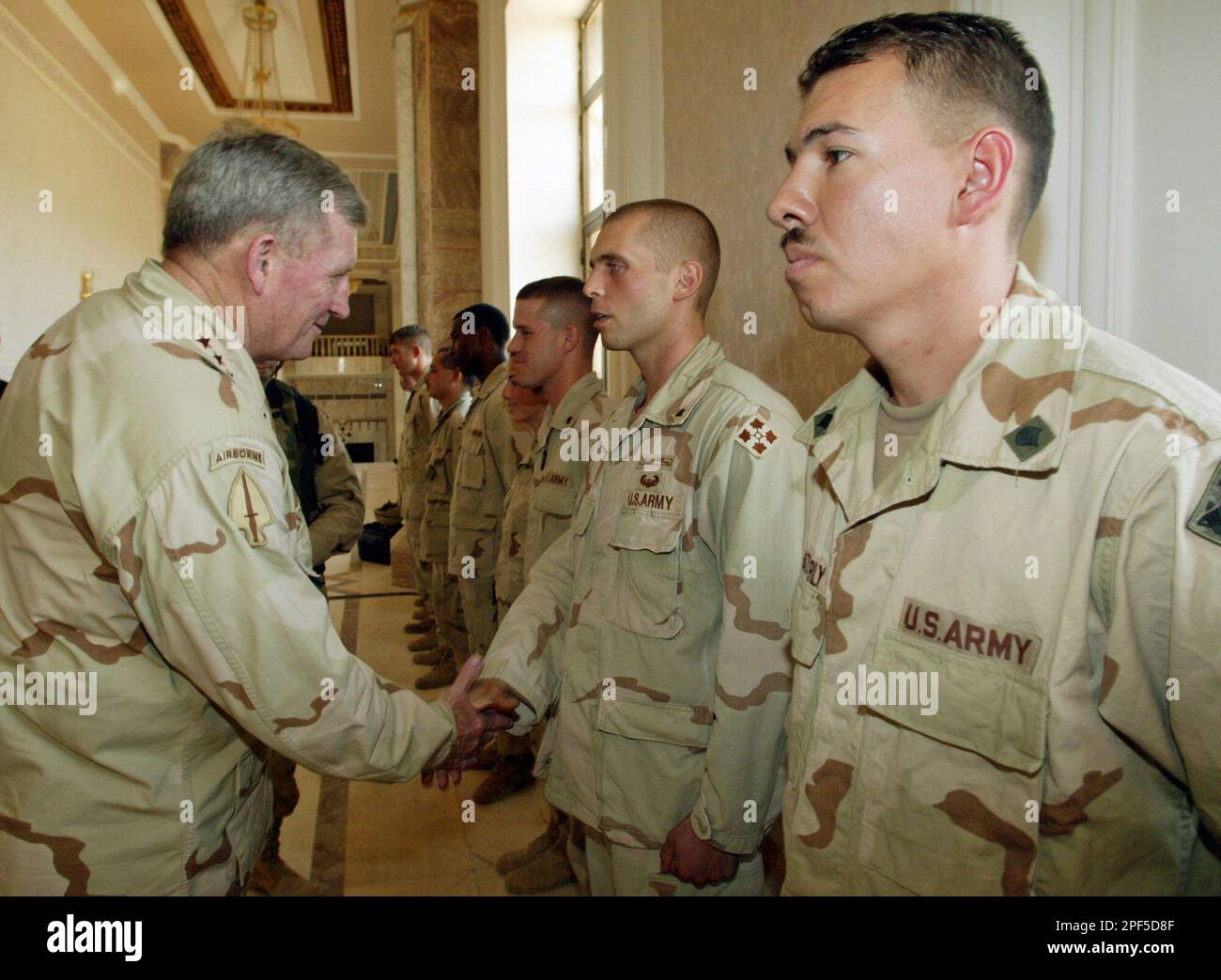 U.S. Army Chief of Staff Gen. Peter Schoomaker greets Spc. Andrew Green ...