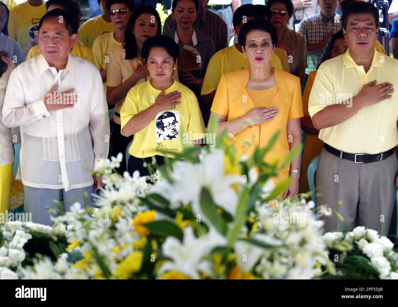 Former Philippine President Corazon "Cory" Aquino, 2nd from right, President Gloria Macapagal ...