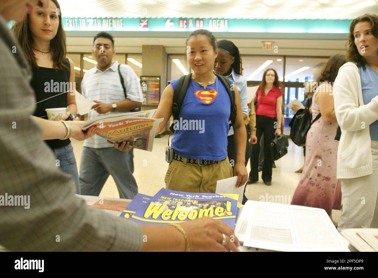 Valerie Ho, 25 , of the Queens borough of New York, center, takes ...