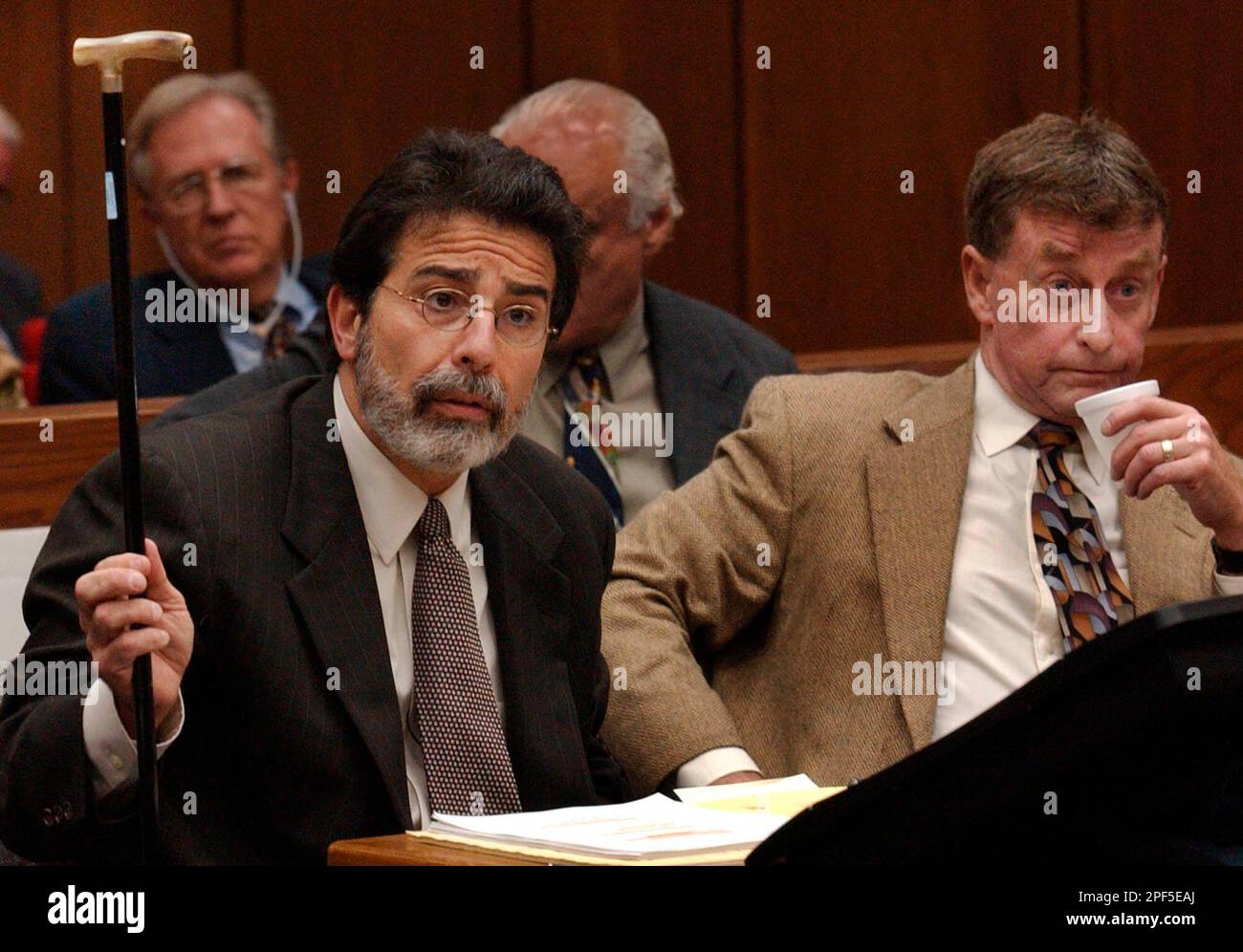 Defense attorney David Rudolf, left, asks SBI blood spatter expert and ...
