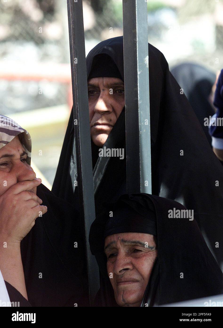 Iraqi women wait outsid the Italian Red Cross hospital to see doctor ...