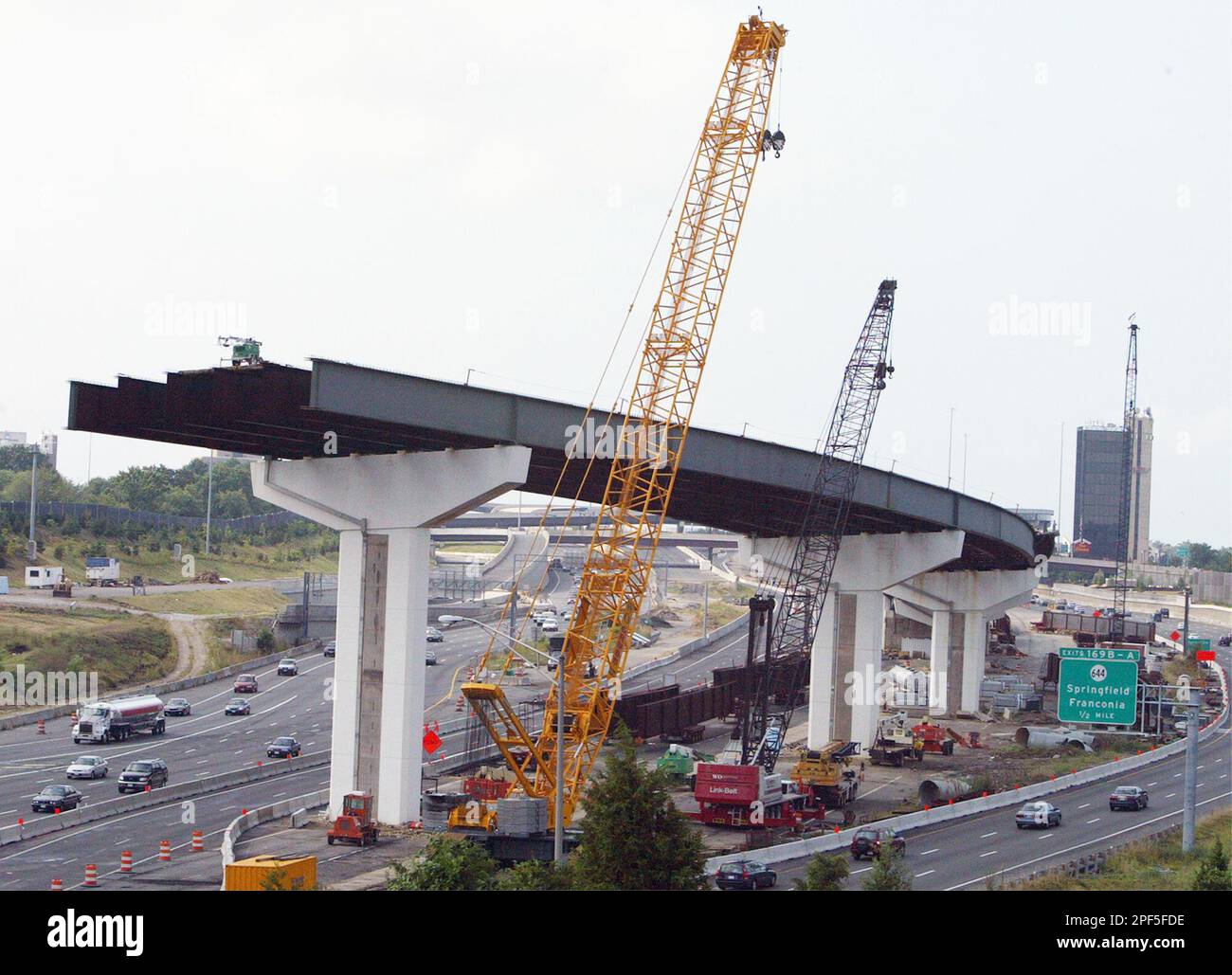 Construction cranes are idle at the site of an unfinished flyover at ...