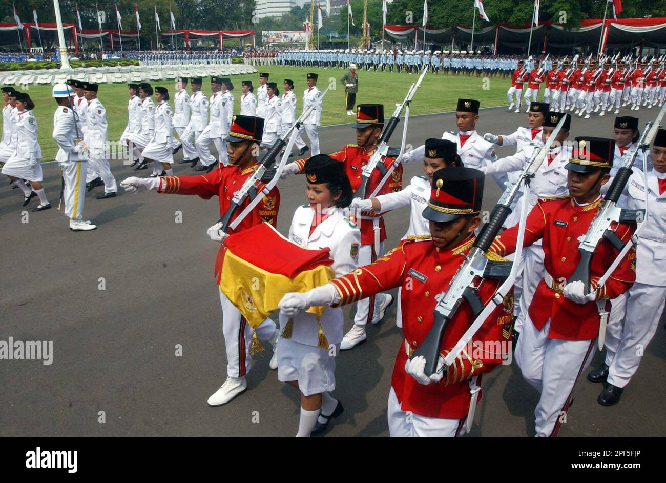 An unidentified flag bearer carries the Indonesian national flag during ...