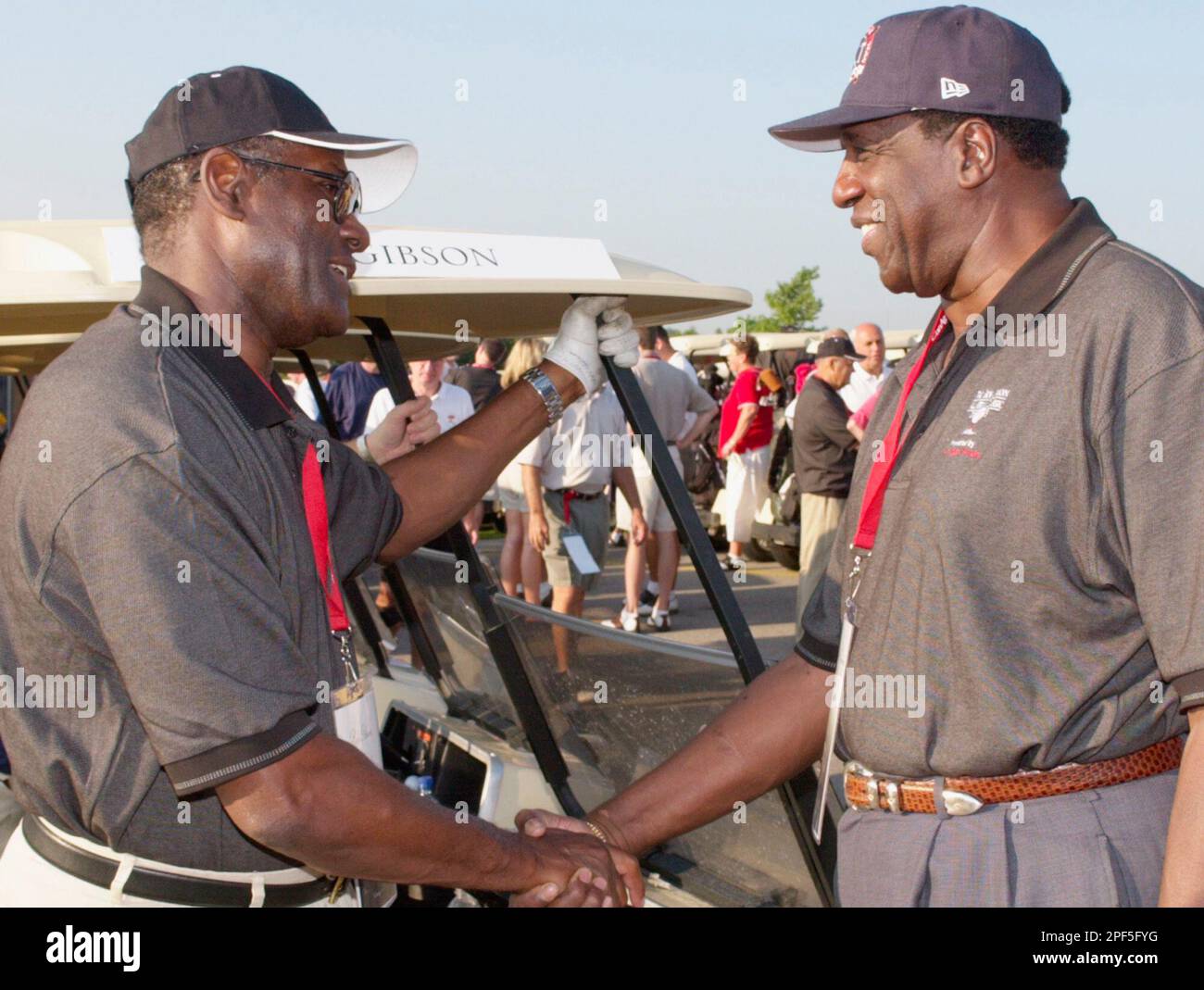 Bob Gibson, left, greets Harlem Globetrotter legend Meadowlark Lemon at ...