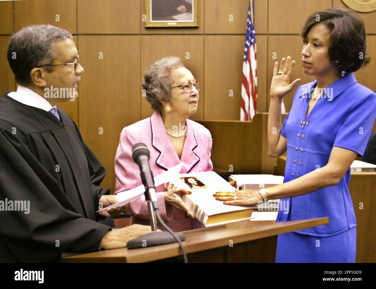 Allyson Duncan, right, is administered the oath by her husband, U.S ...