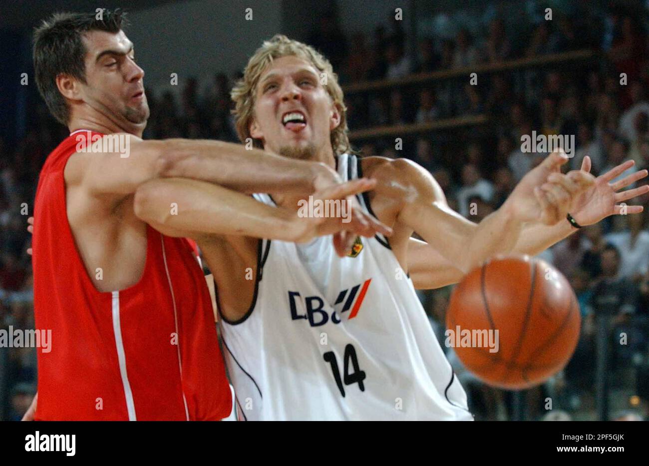 Germanys Dirk Nowitzki, right, goes up for a shot against Turkeys guard ...