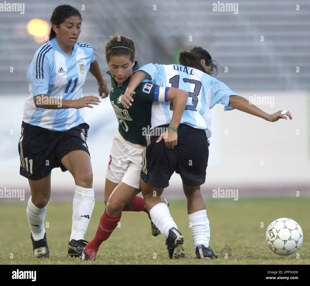 Mexican Adriana Mora, center, fights with Argentina's Marisol Medina ...