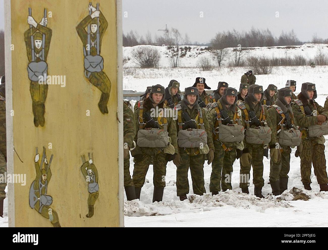 Paratroopers of the 104st Airborne Regiment prepare for loading onto a ...